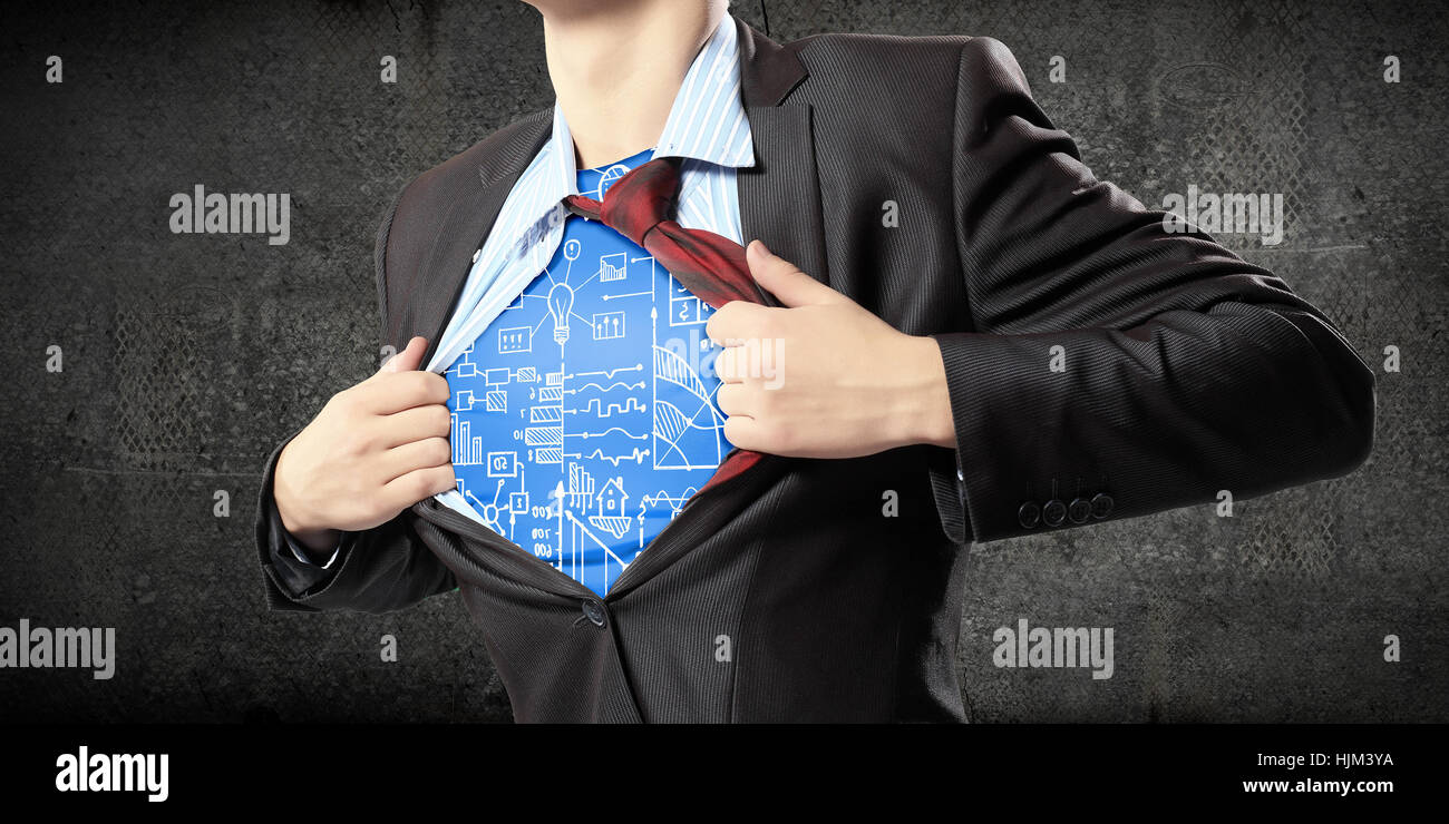 Young businessman opening chest and acting like super hero hi-res stock ...
