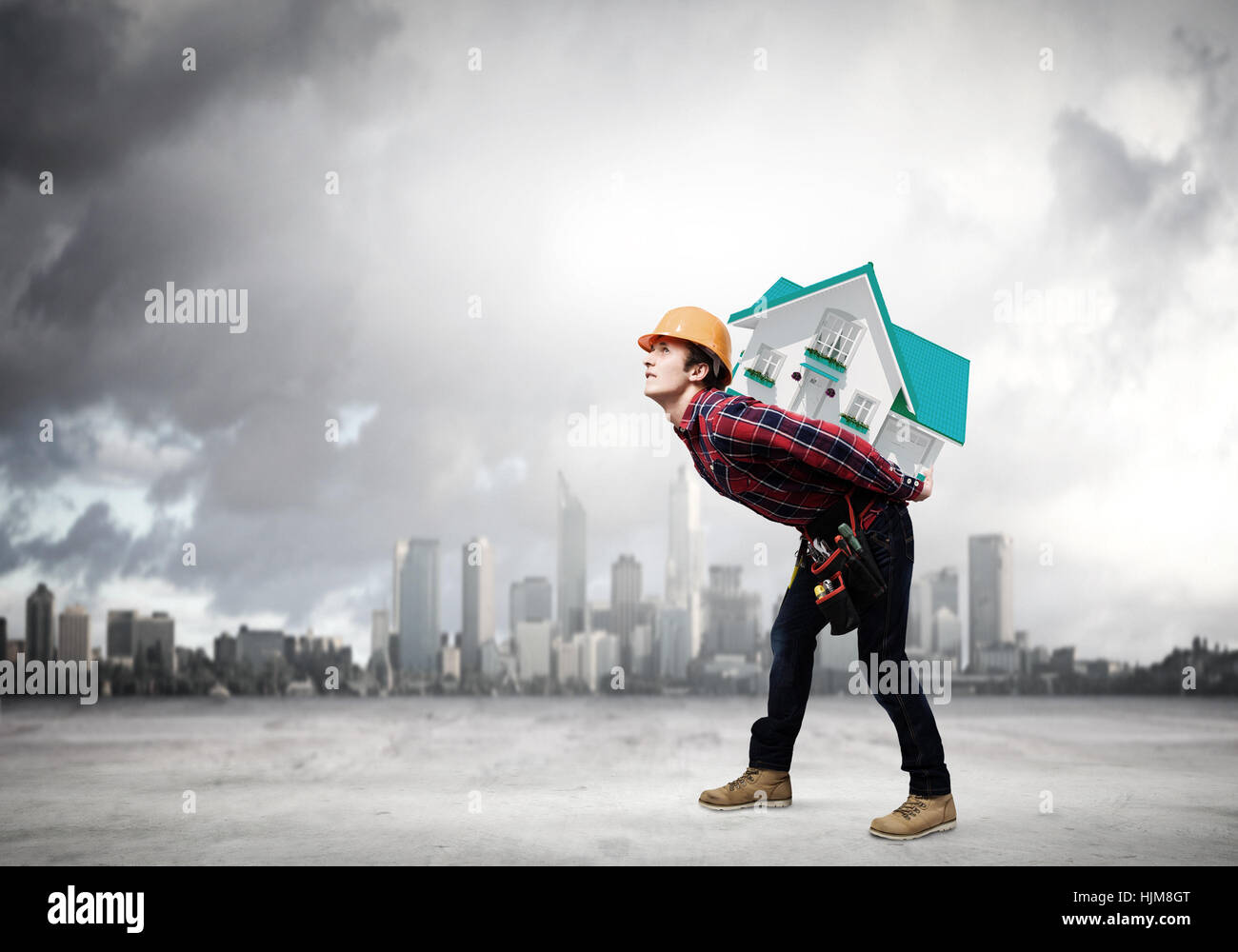Builder carrying building block hi-res stock photography and images - Alamy