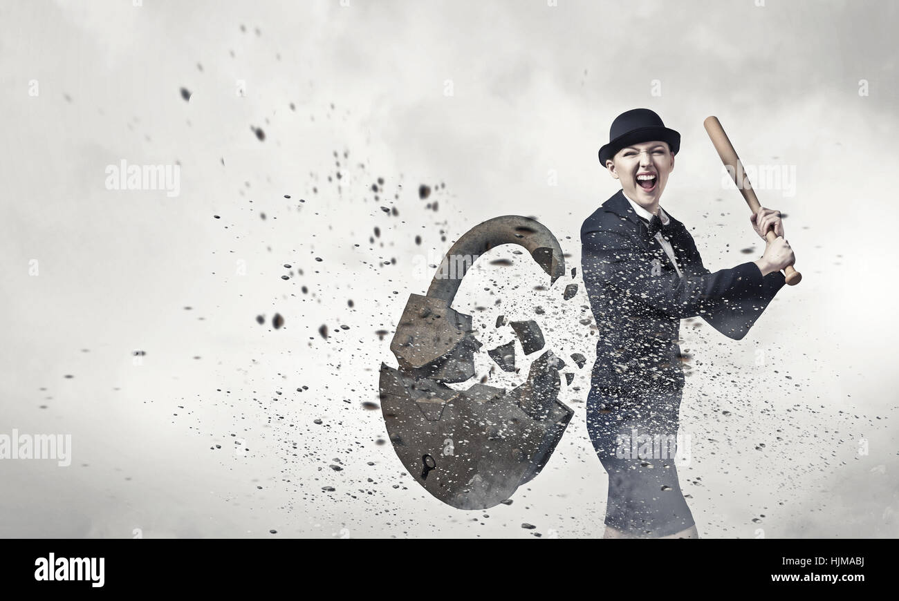 Young emotional woman crashing lock with baseball bat Stock Photo - Alamy