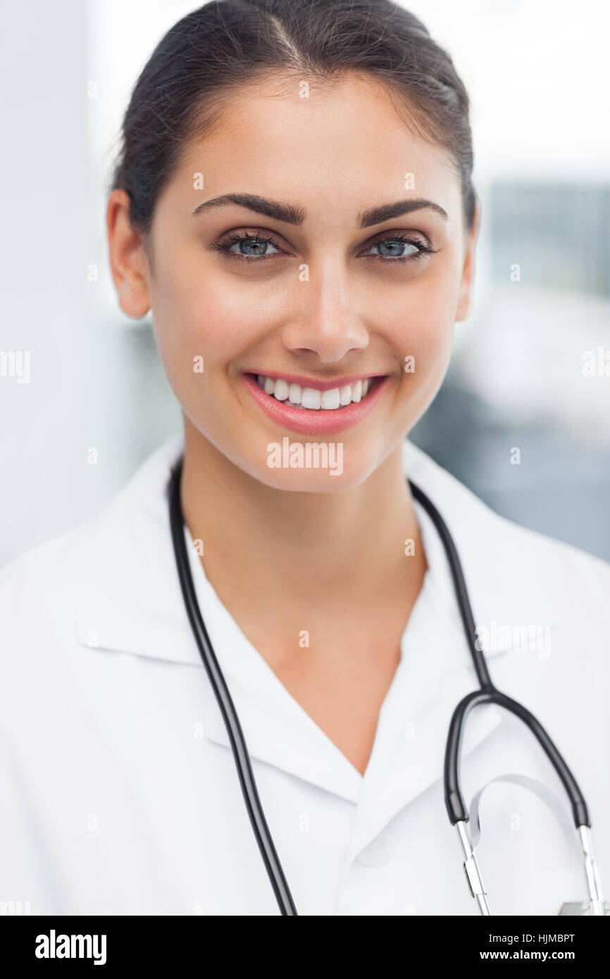 Attractive woman doctor looking at the camera Stock Photo - Alamy