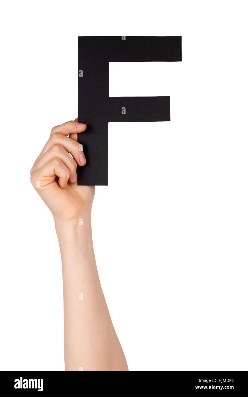 the black letter F, hold by a hand, isolated Stock Photo - Alamy