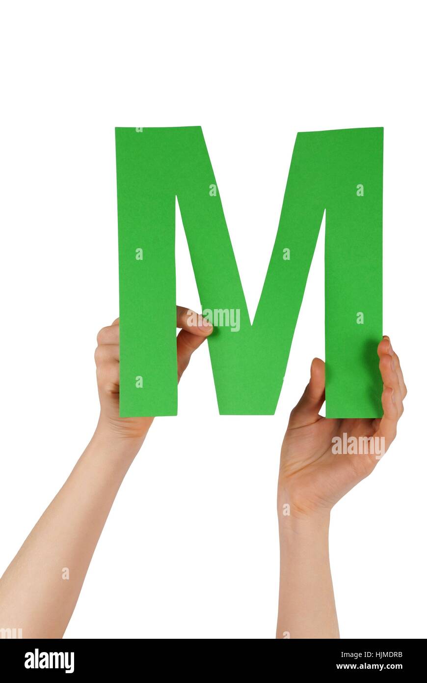 the green letter M, hold by hands, isolated Stock Photo - Alamy