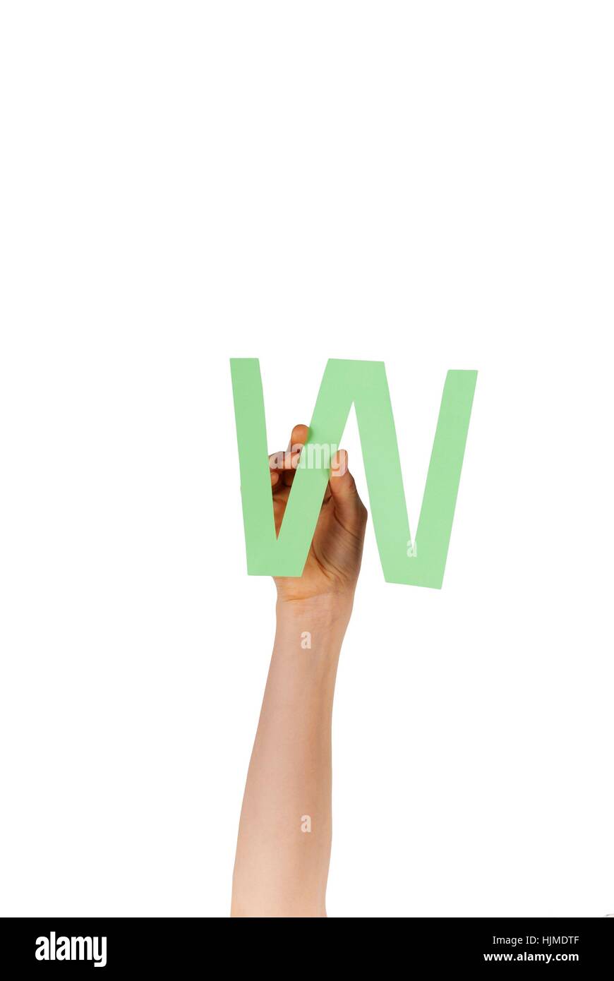 the letter W, hold by a hand, isolated Stock Photo - Alamy