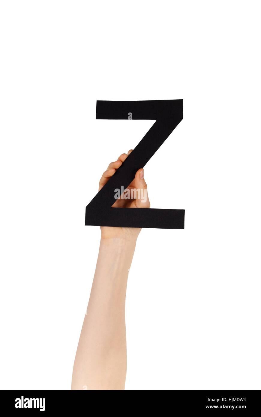 the letter Z, hold by a hand, isolated Stock Photo - Alamy