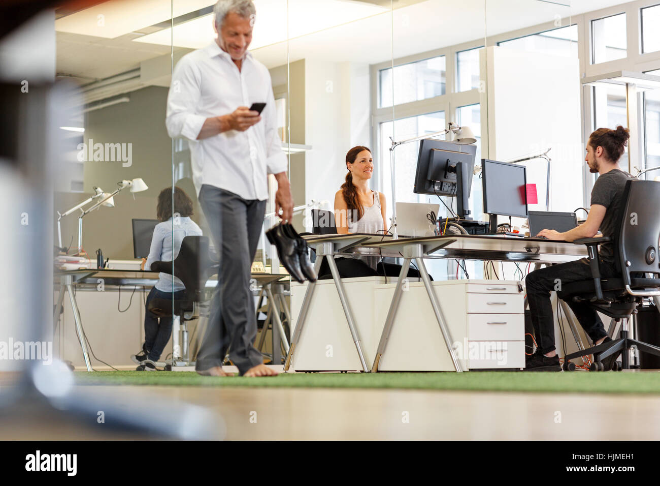 People working in modern office Stock Photo - Alamy