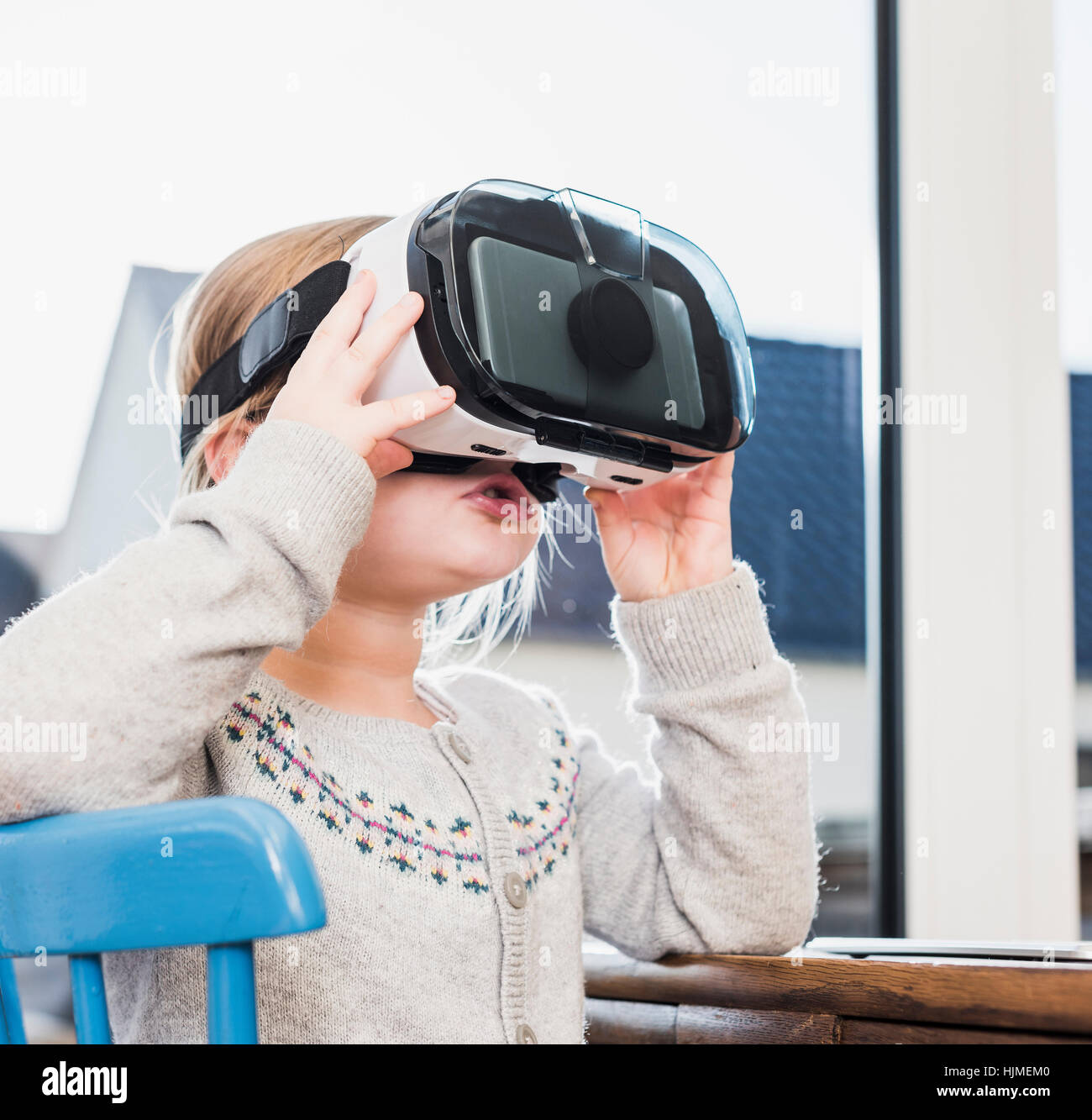 Little girl using VR glasses Stock Photo - Alamy