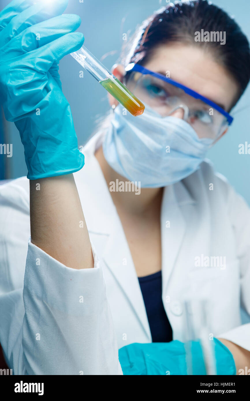 Pouring liquid laboratory test tubes hi-res stock photography and ...