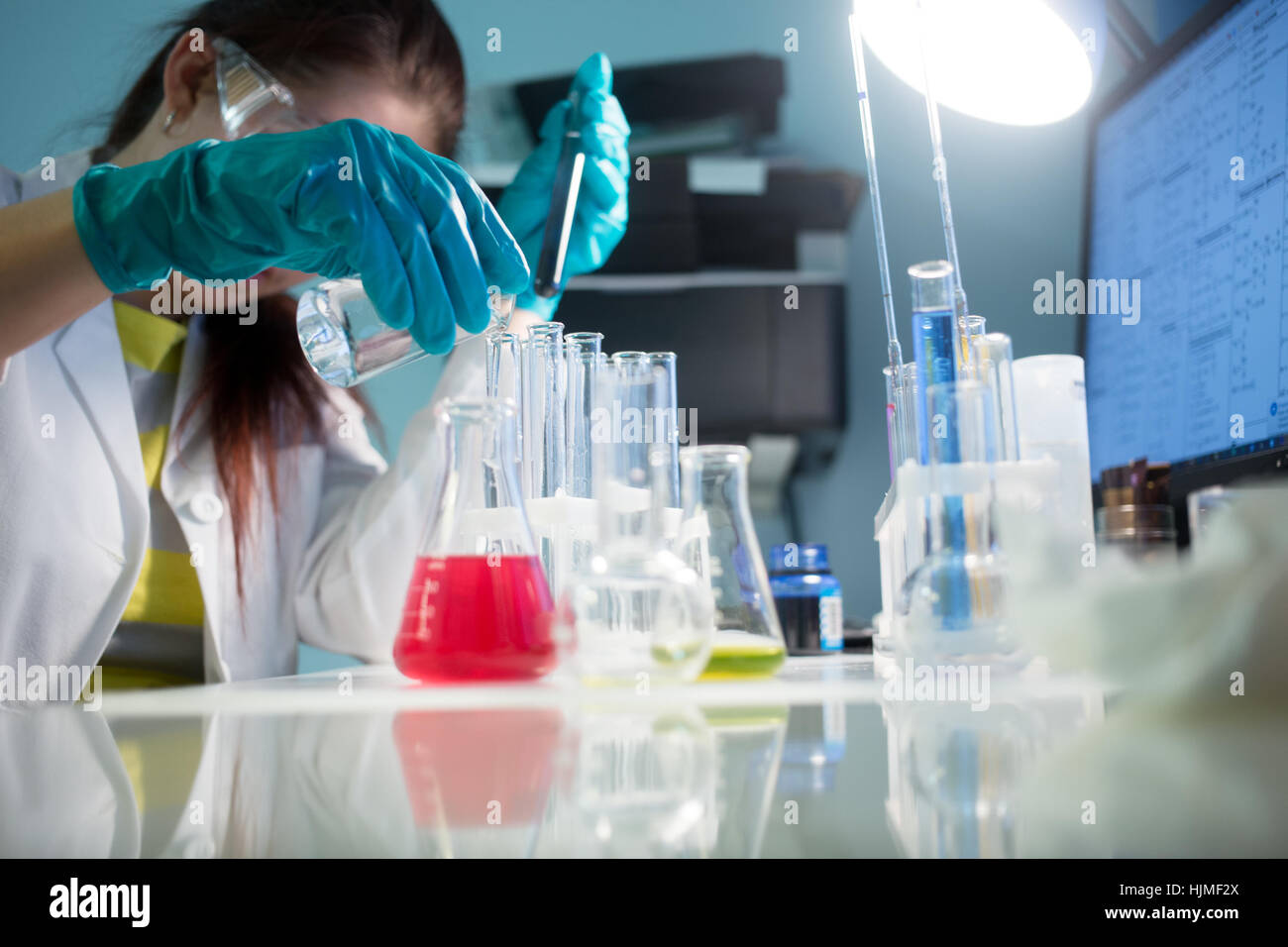 Woman with laboratory test tubes Stock Photo - Alamy