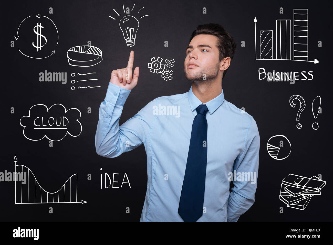 Handsome young man presenting business ideas Stock Photo - Alamy