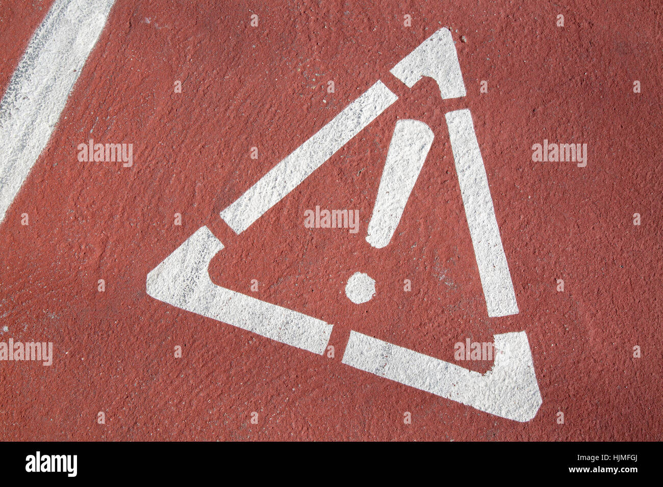 Exclamation Mark in Triangle Printed on Road Surface Stock Photo - Alamy