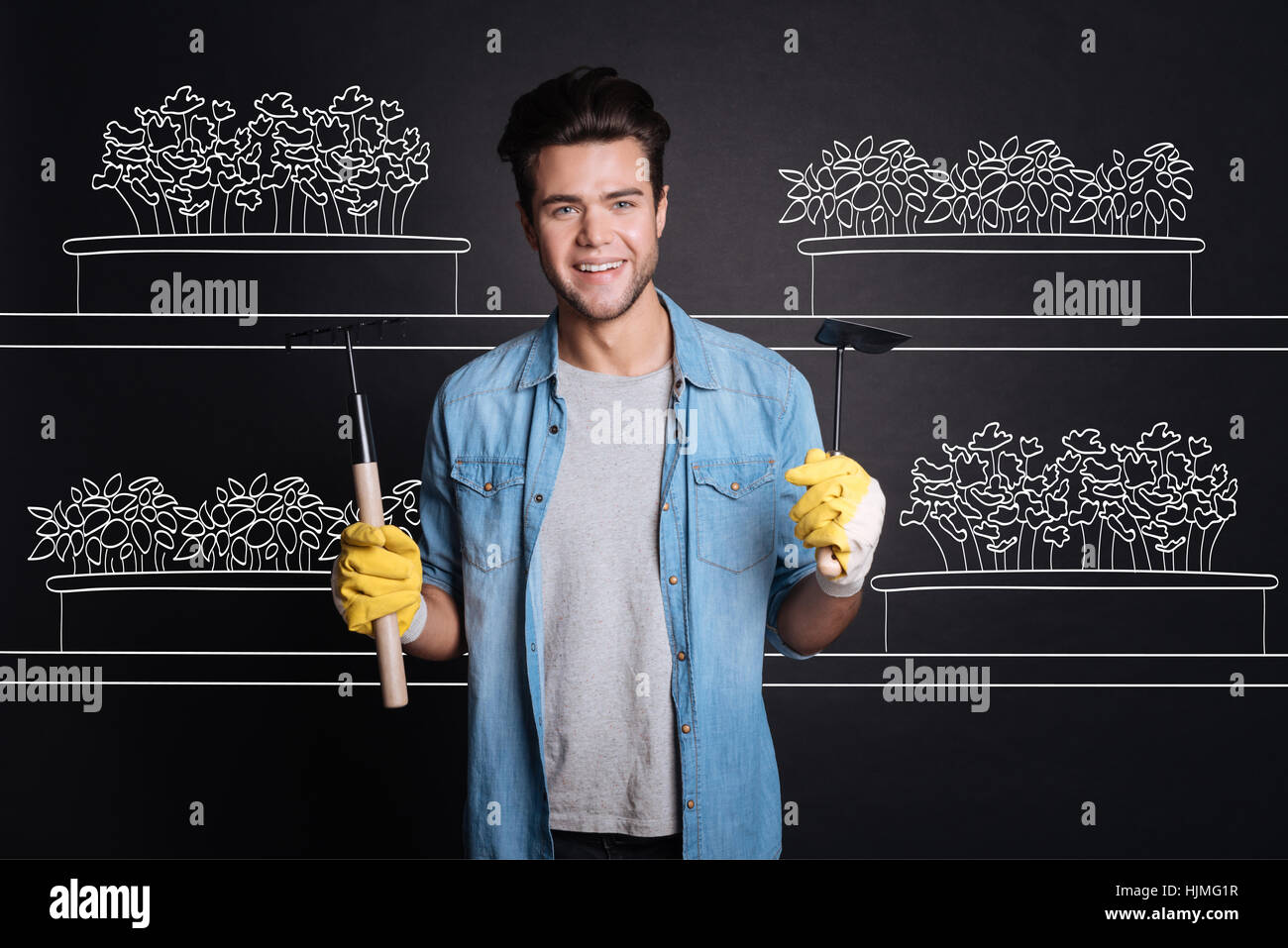 Handsome man gardening tools hi-res stock photography and images - Alamy