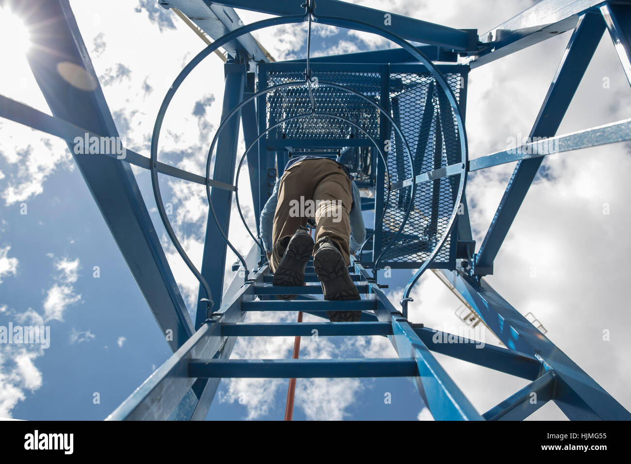 Worker climbing construction crane hi-res stock photography and images ...