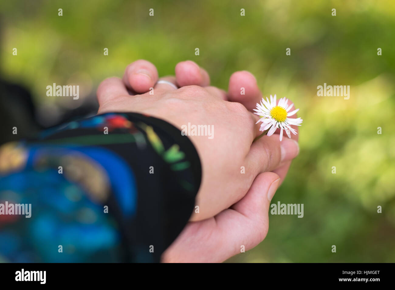 Holding between fingers hi-res stock photography and images - Alamy