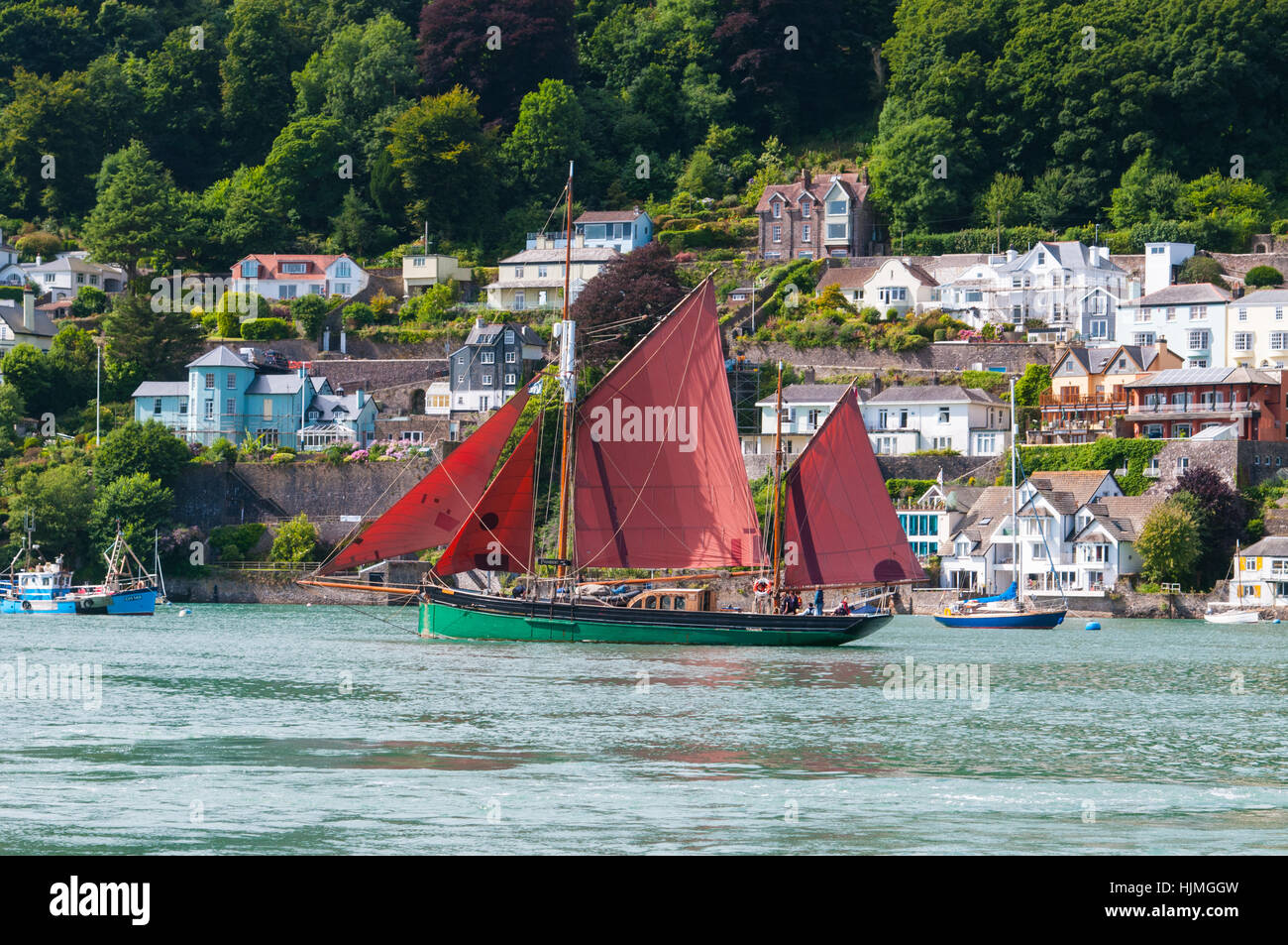 red sailed boat Stock Photo - Alamy