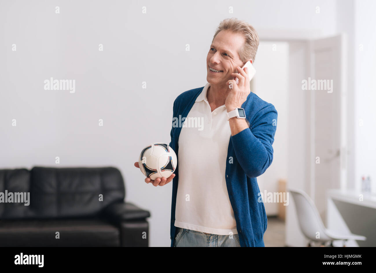 Cheerful happy man making a phone call Stock Photo - Alamy