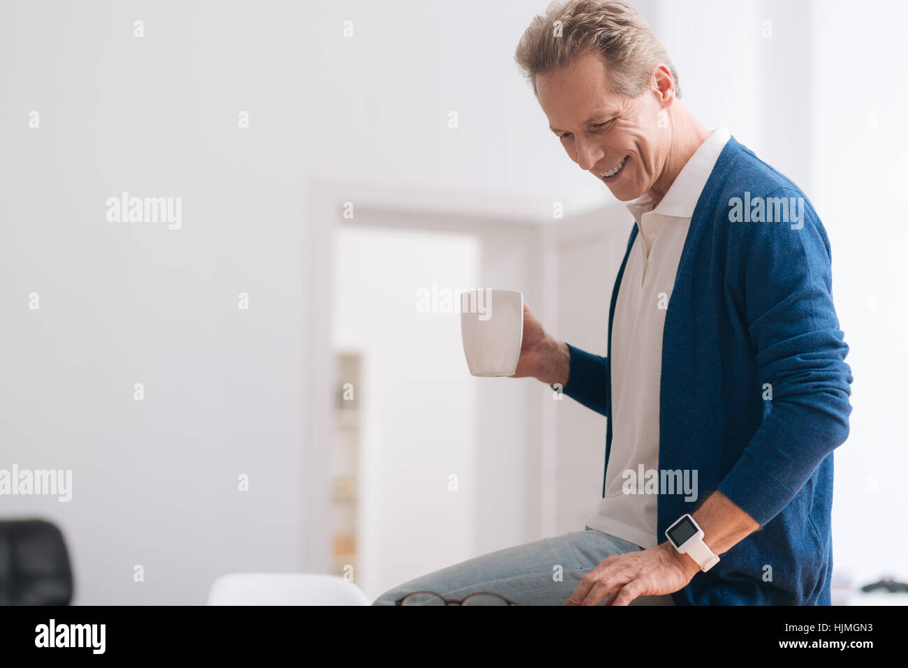Handsome attractive man having tea Stock Photo - Alamy