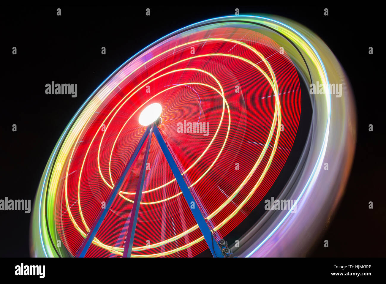 Moving big wheel at night Stock Photo - Alamy