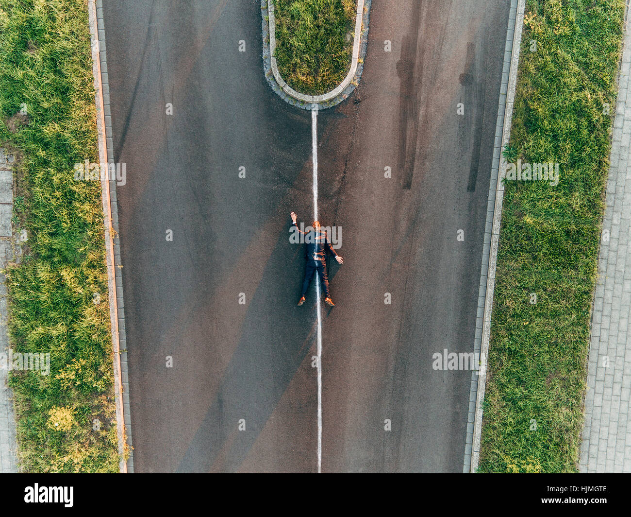 Run over man lying on road Stock Photo - Alamy