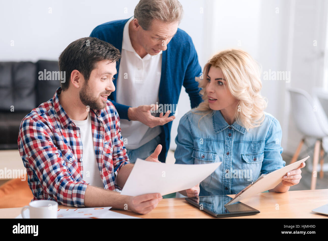 Nice good looking people discussing a project Stock Photo - Alamy
