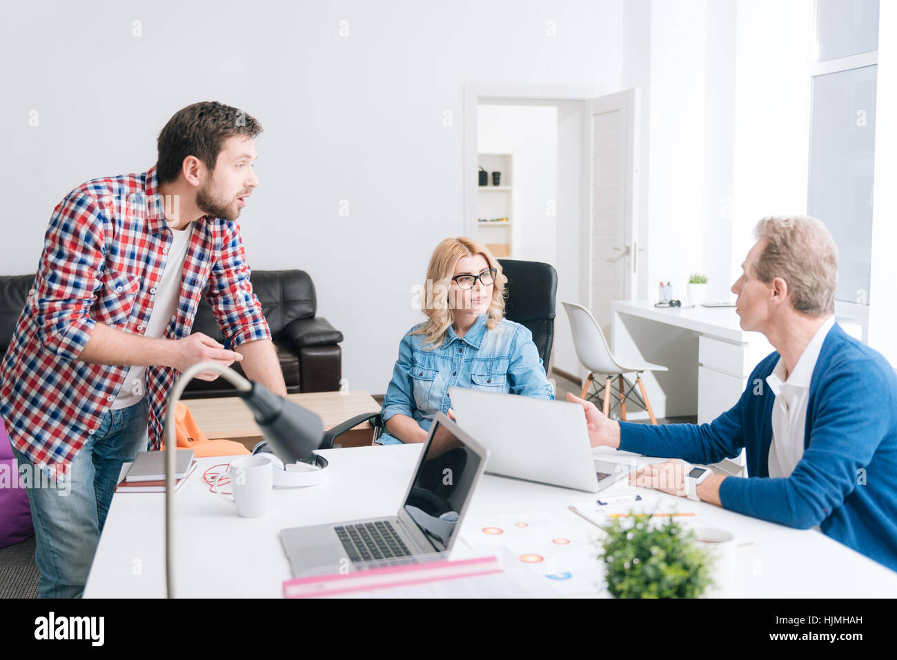 Hard working office workers sitting at the table Stock Photo - Alamy