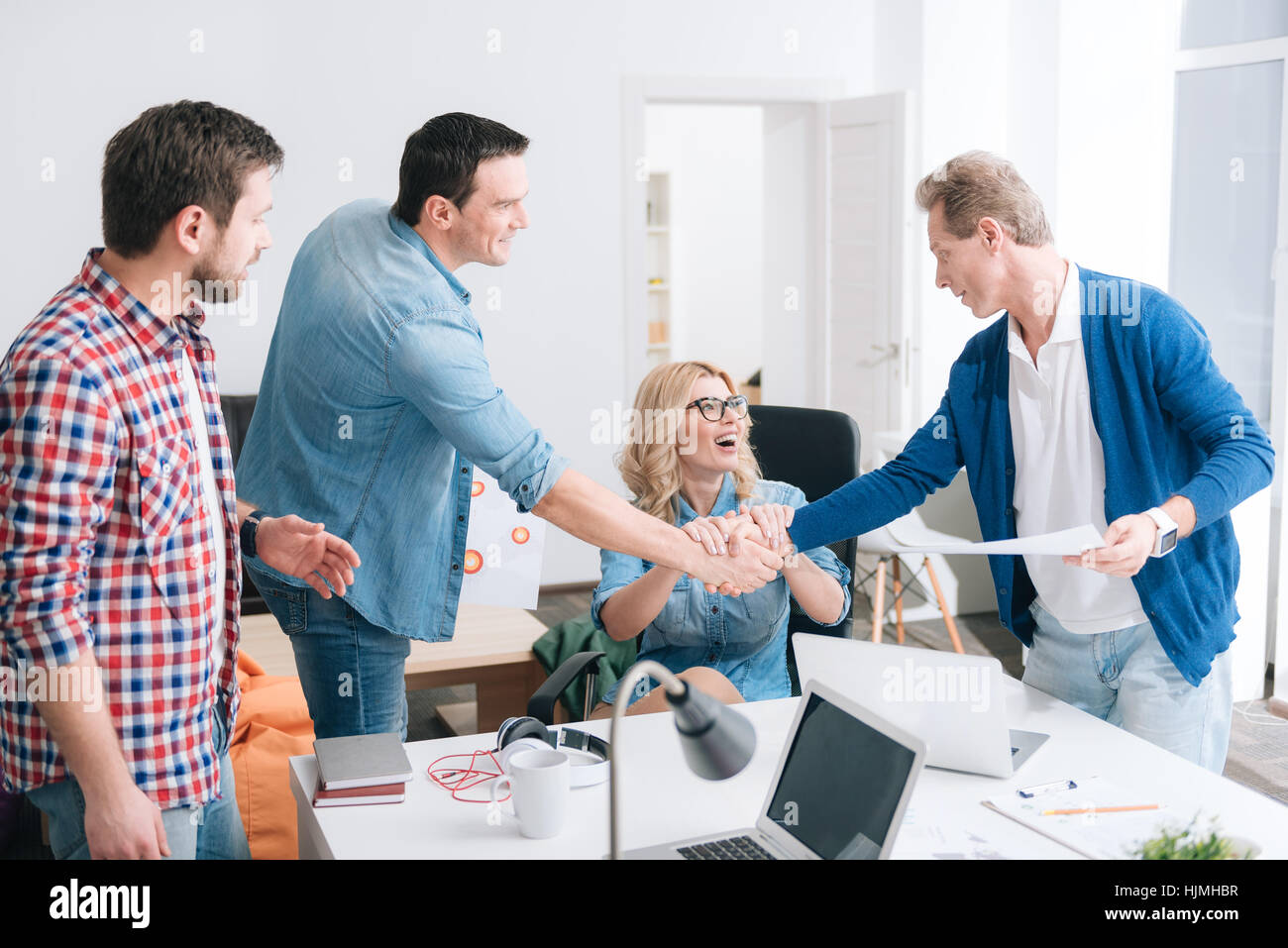 Nice handsome men shaking hands Stock Photo - Alamy