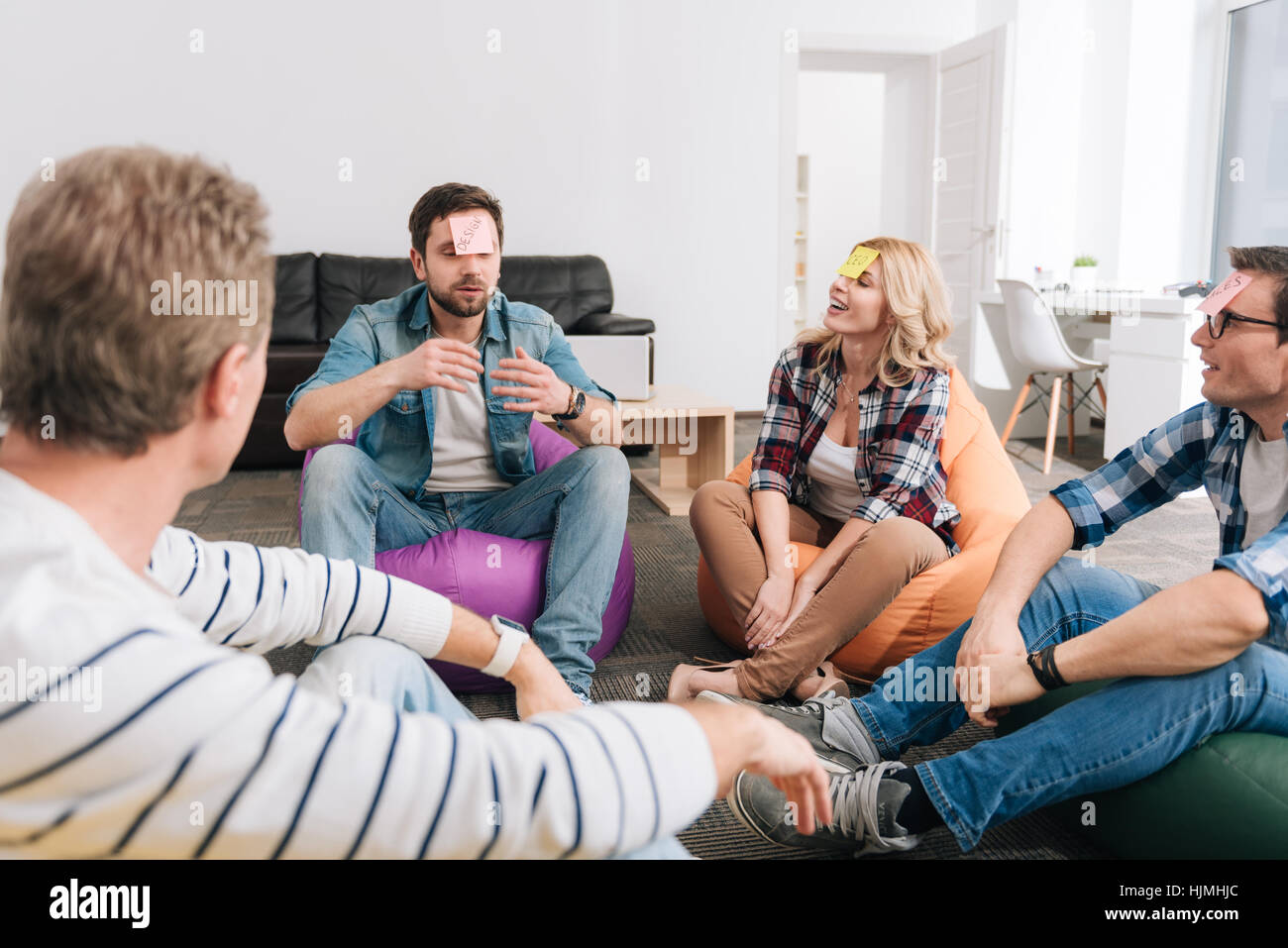 Positive happy people guessing words Stock Photo - Alamy