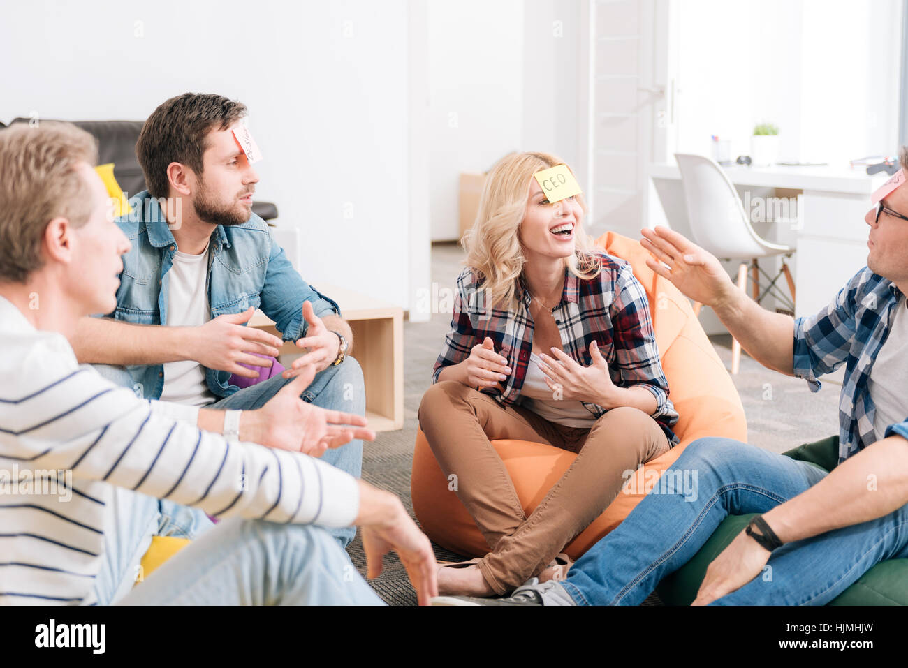 Joyful delighted group of office workers playing a game Stock Photo - Alamy