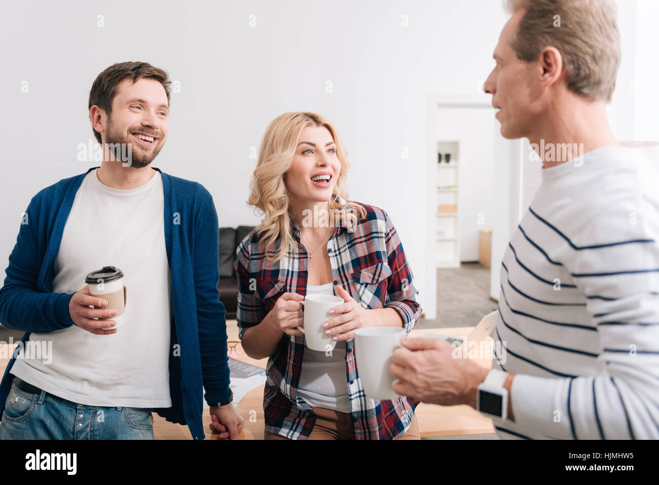 Nice positive people talking to each other Stock Photo - Alamy