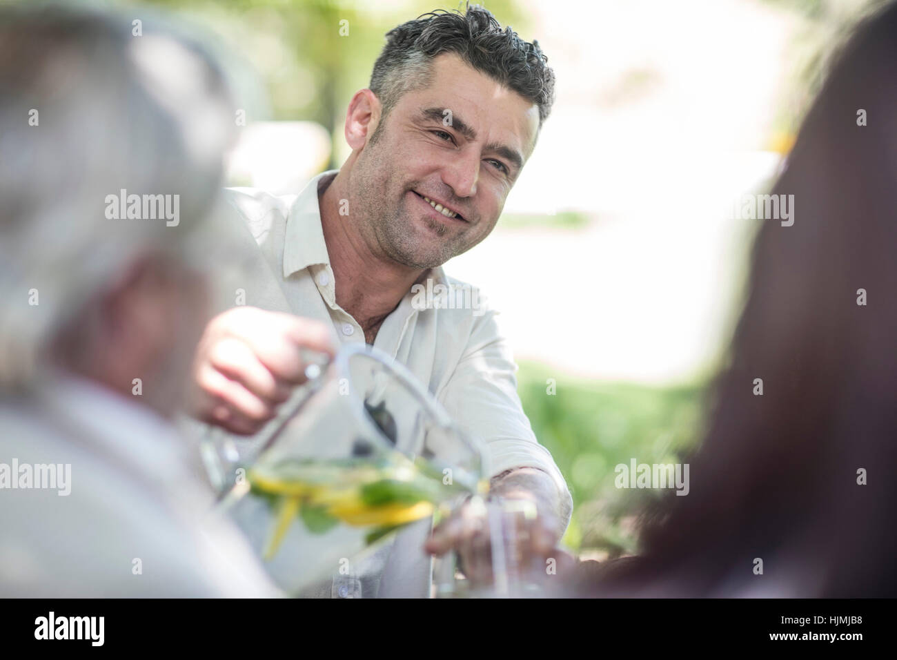 Smiling man pouring lemonade hi-res stock photography and images - Alamy
