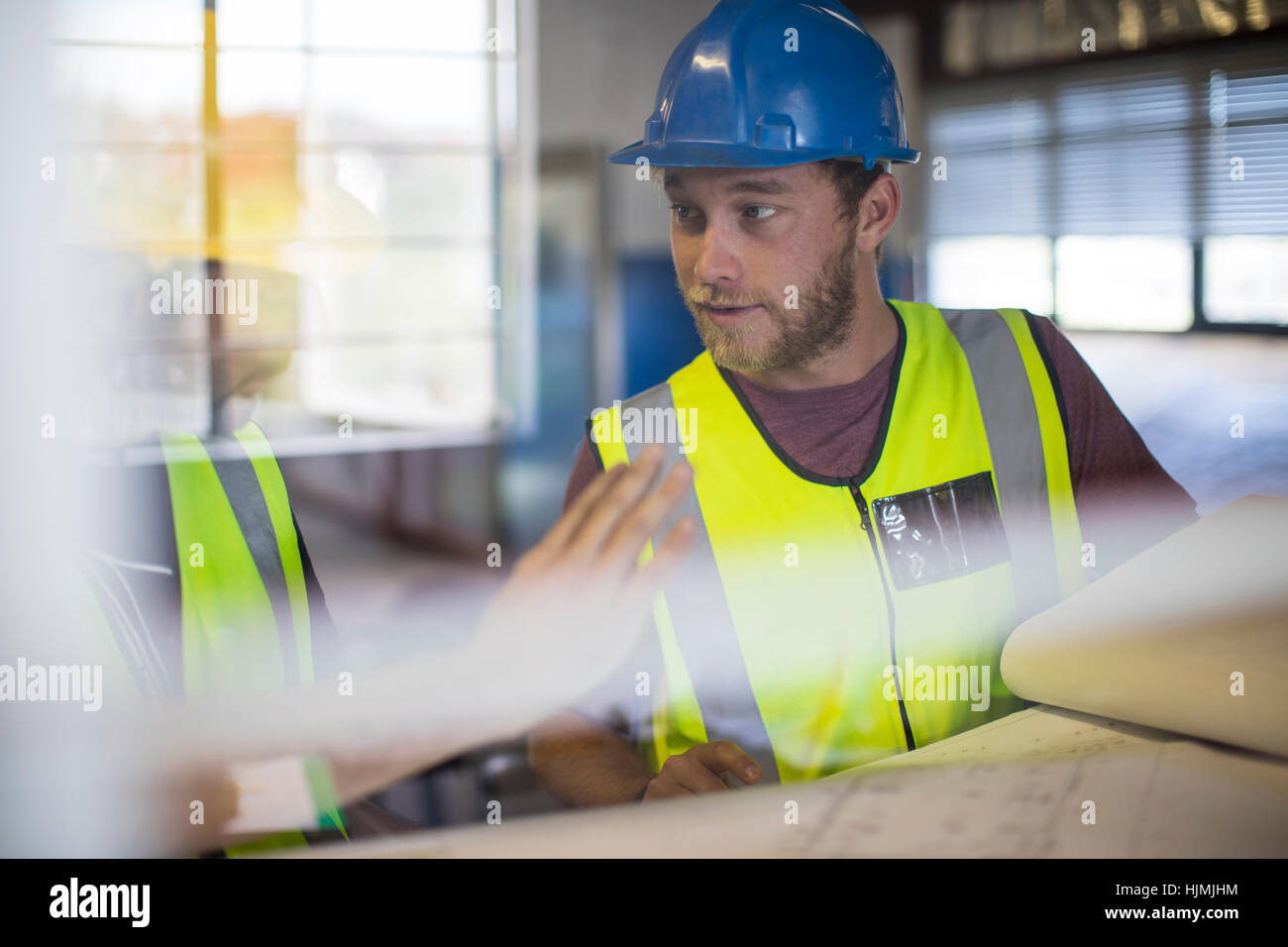 Construction worker in meeting at site office Stock Photo - Alamy