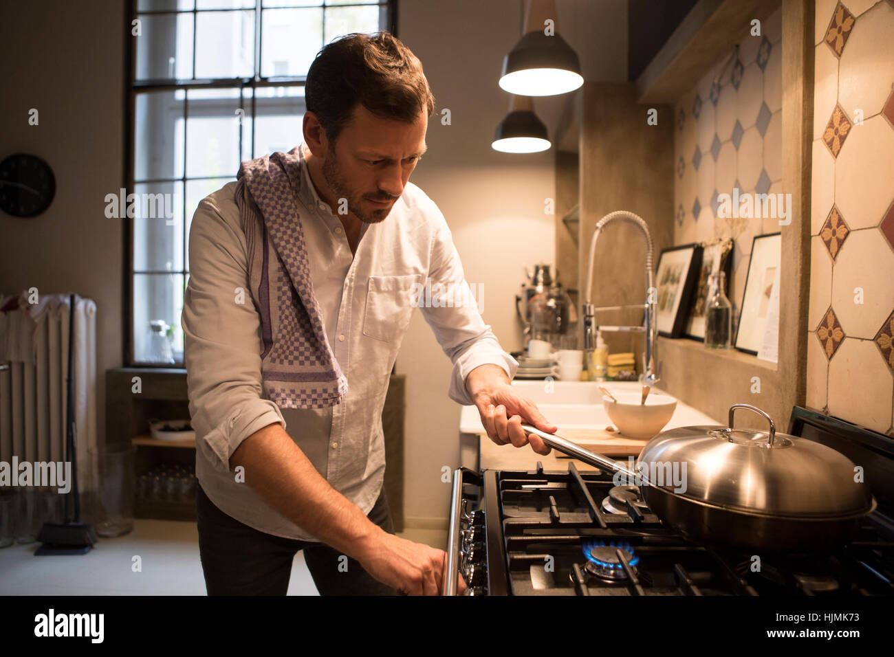 Man cooking at home Stock Photo - Alamy