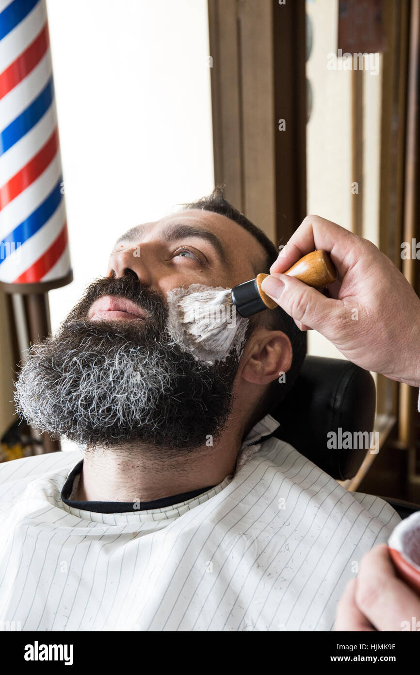 Close up barber putting shaving hi-res stock photography and images - Alamy