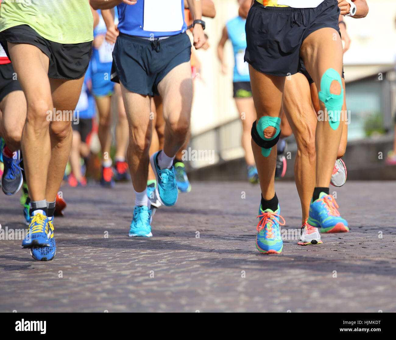 many people run fast during sports race through the streets of the city ...