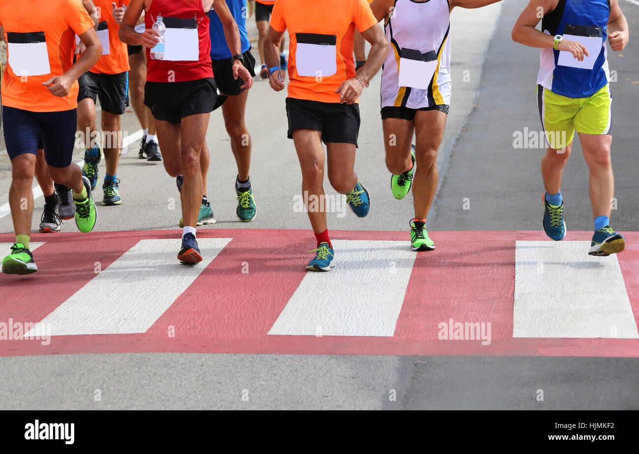 Runners crossing the finish line hi-res stock photography and images ...