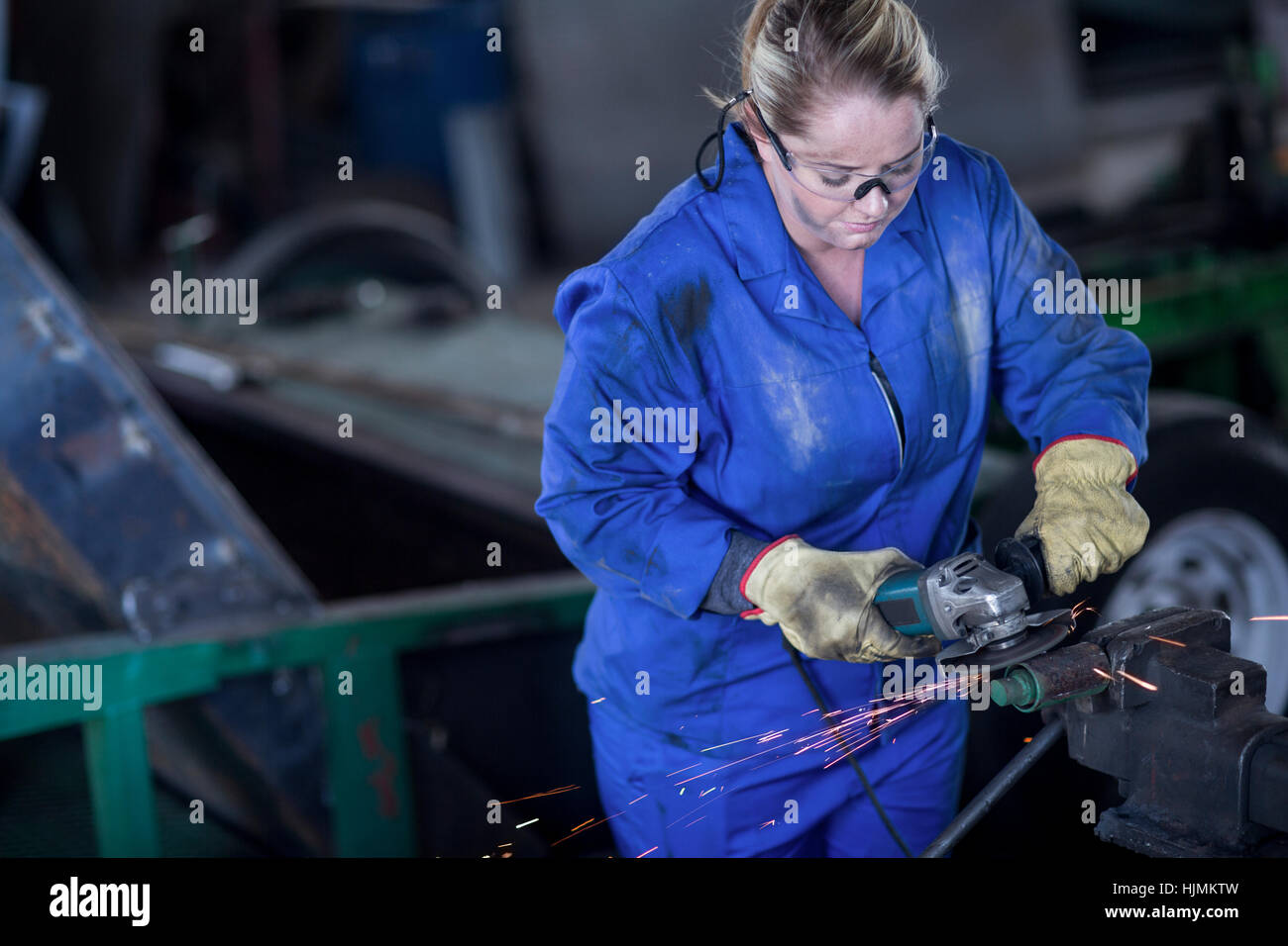 Woman using angle grinder hi-res stock photography and images - Alamy
