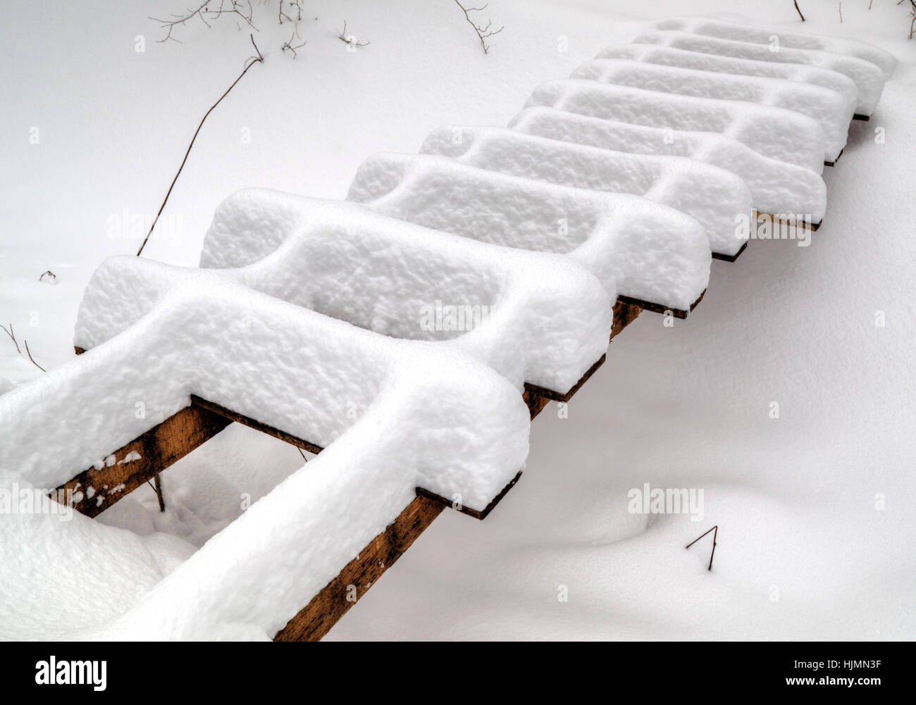 Wooden bridge covered with snow in winter Stock Photo - Alamy