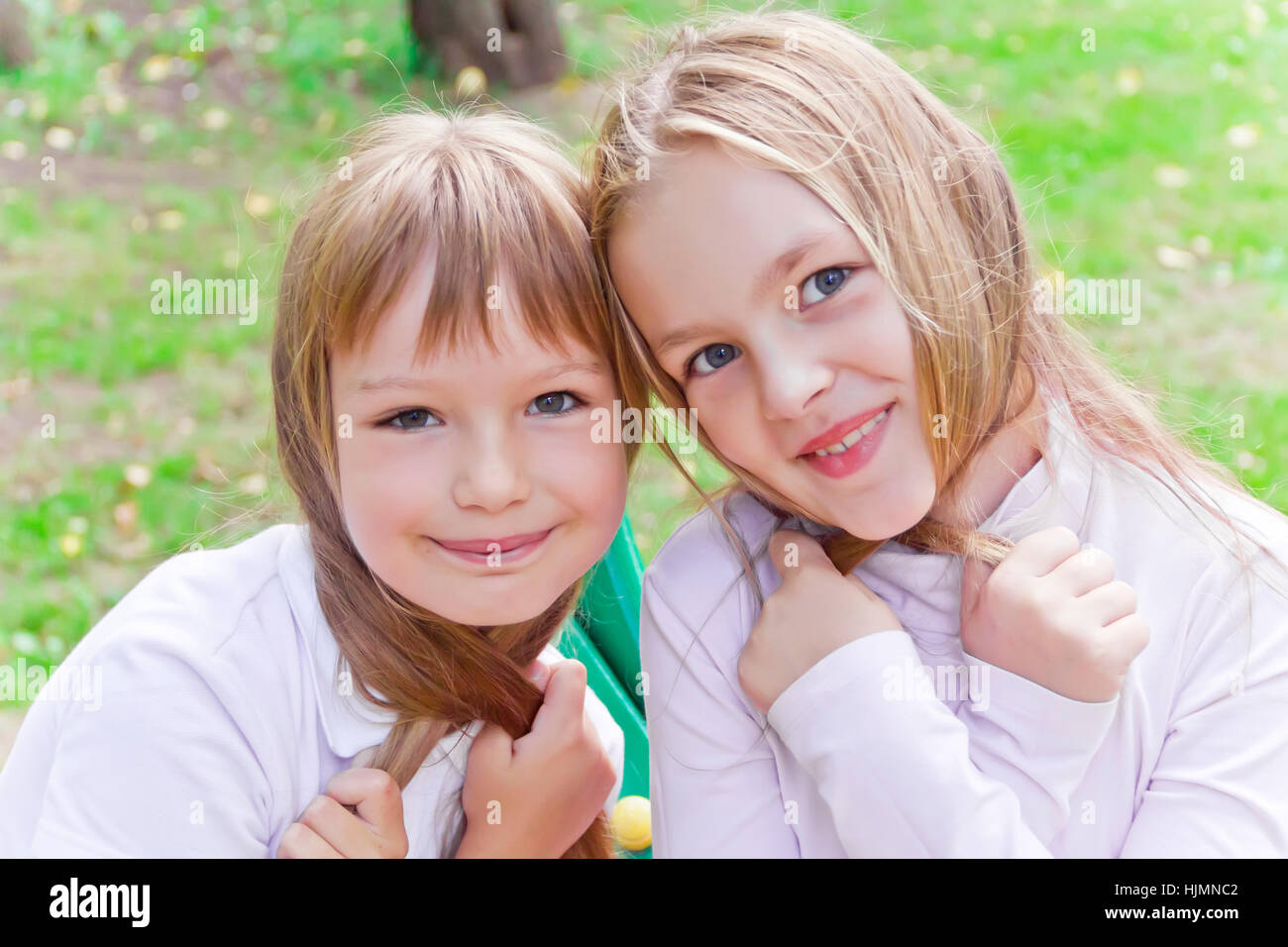 Photo of two playing girls in summer Stock Photo - Alamy
