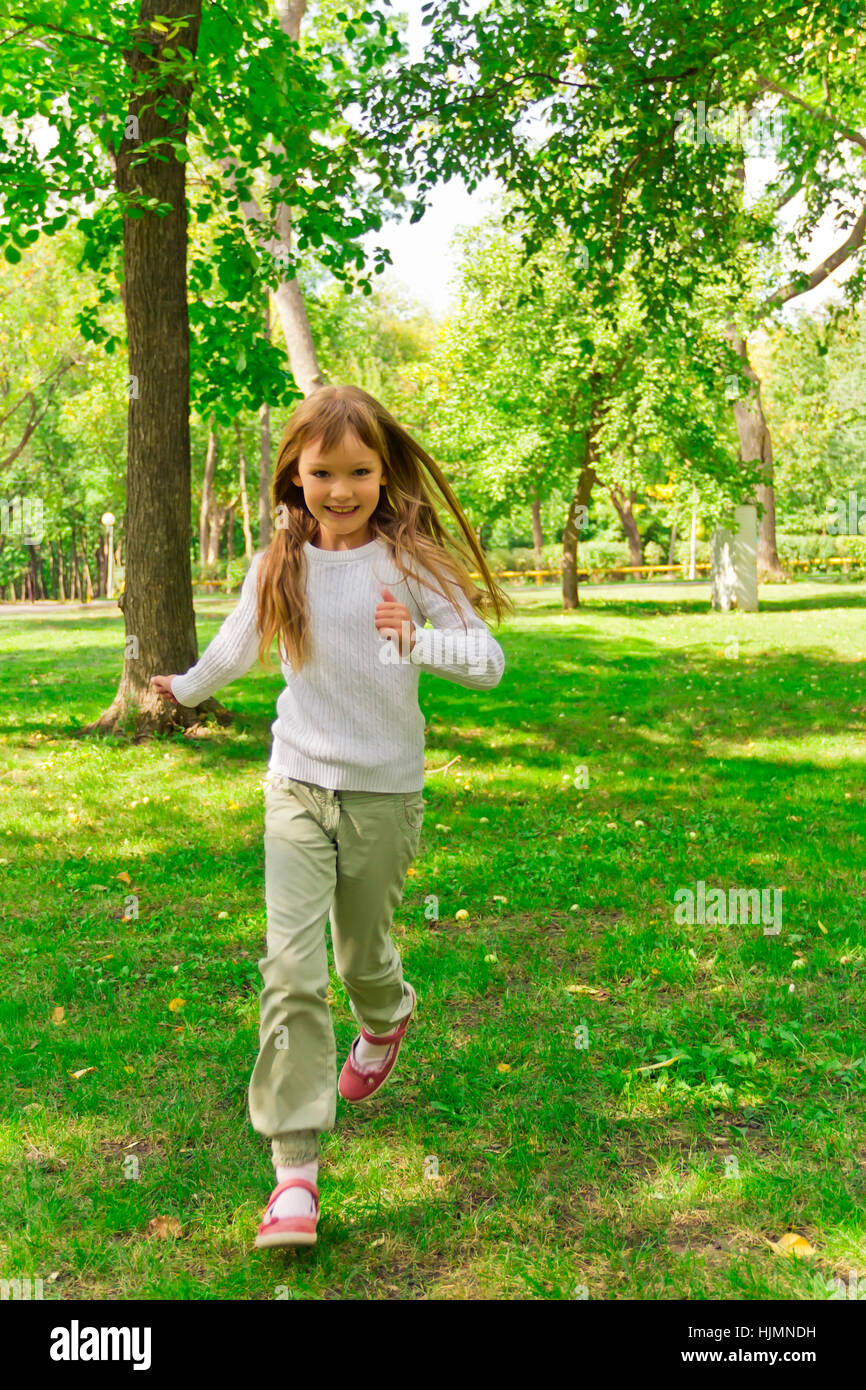 Photo of cute running girl in summer Stock Photo - Alamy