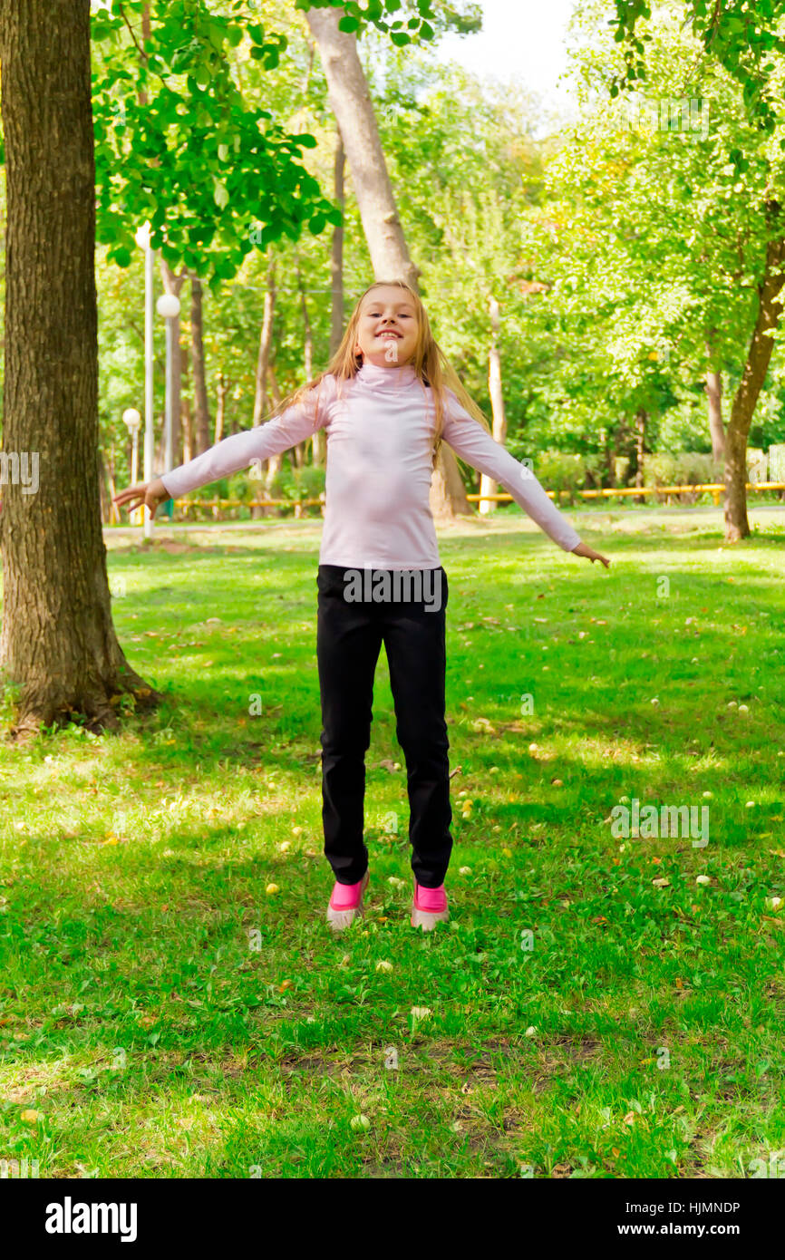 Photo of cute jumping girl in summer Stock Photo - Alamy