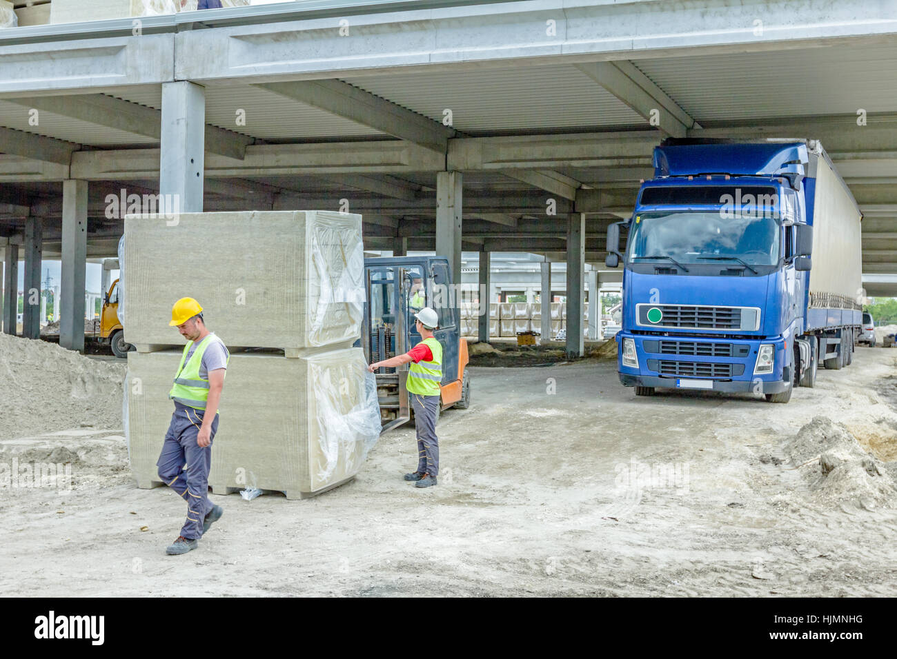 Stack of insulation composite panel walls are piled on building site ...
