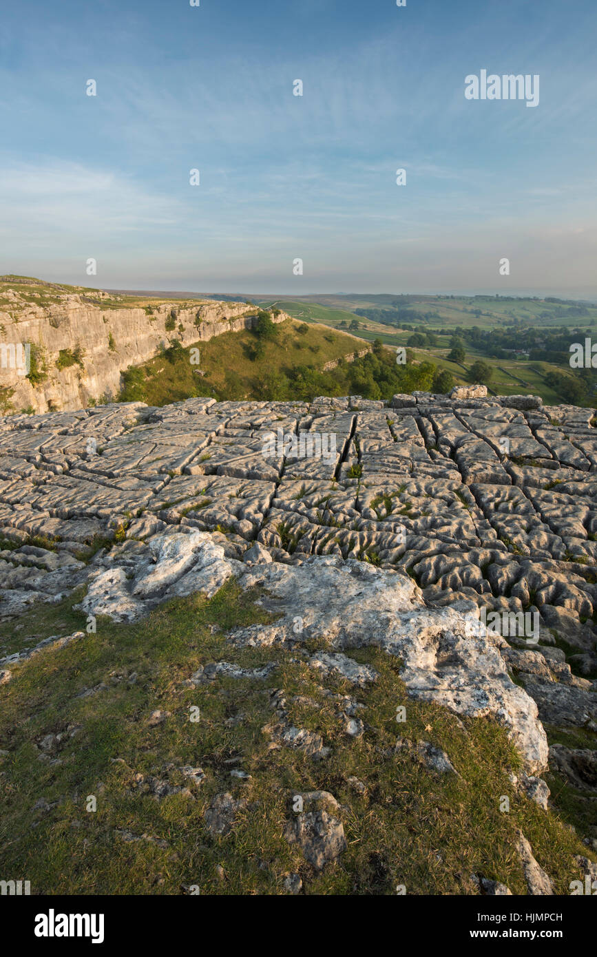 Spectacular view from the limestone pavement at the top of Malham Cove ...