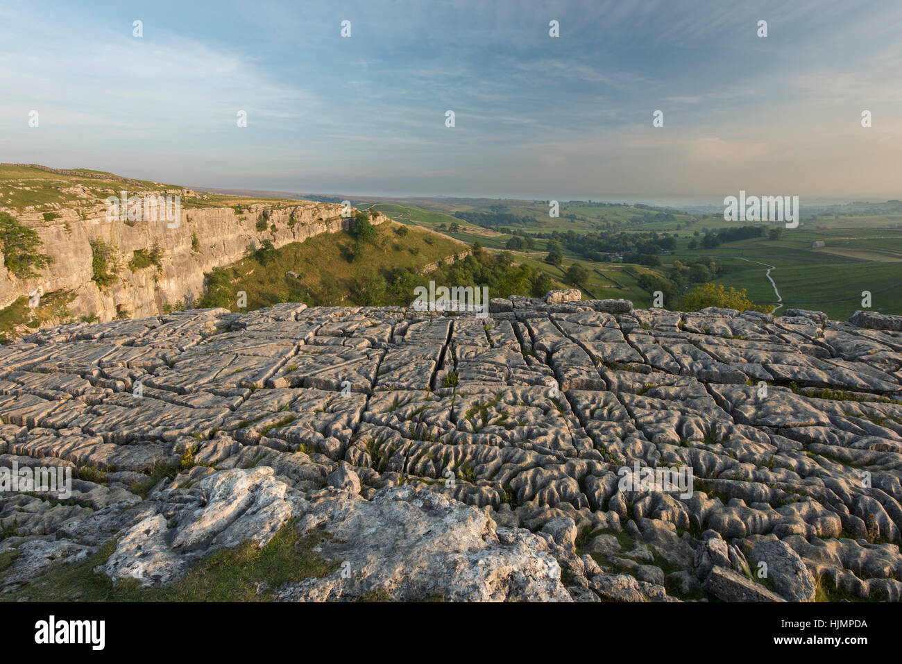 Spectacular view from the limestone pavement at the top of Malham Cove ...