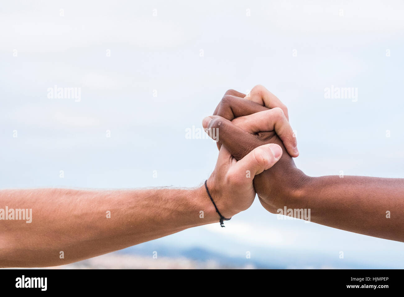 Close-up of two hands connected Stock Photo - Alamy