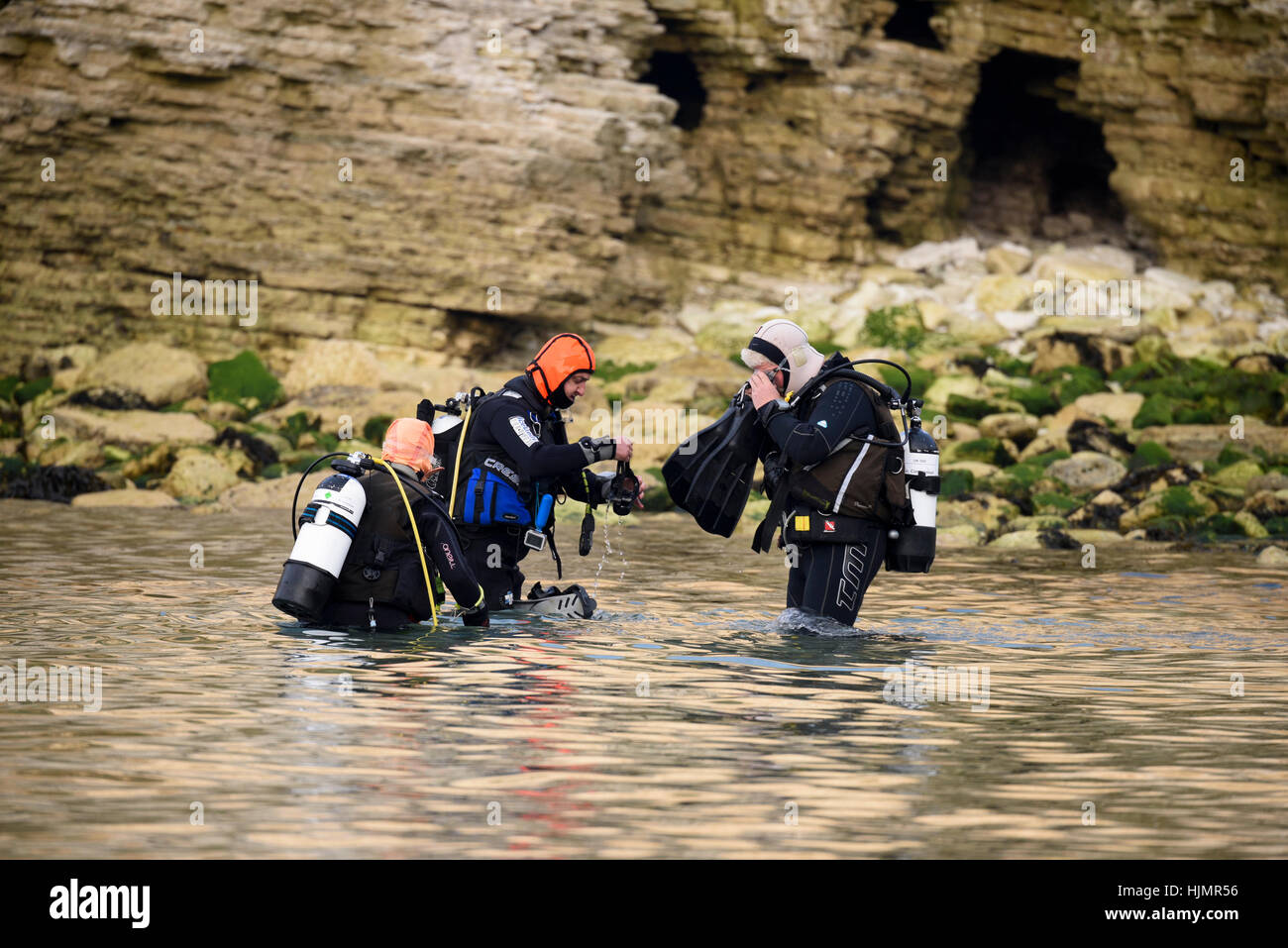 Scuba diving is a popular leisure activity and here, 3 male divers are ...