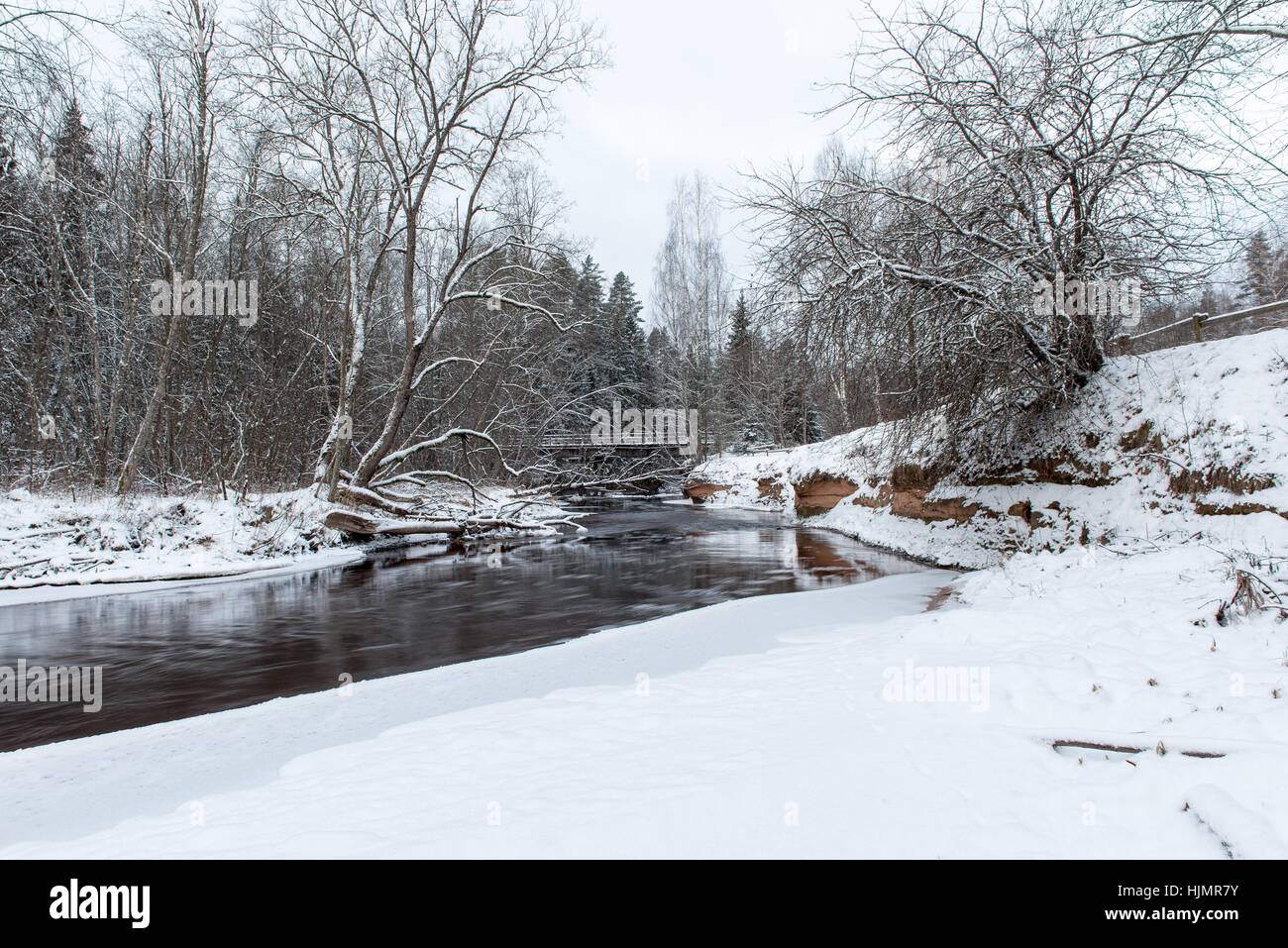 Frozen winter river landscape with ice and snow Stock Photo - Alamy