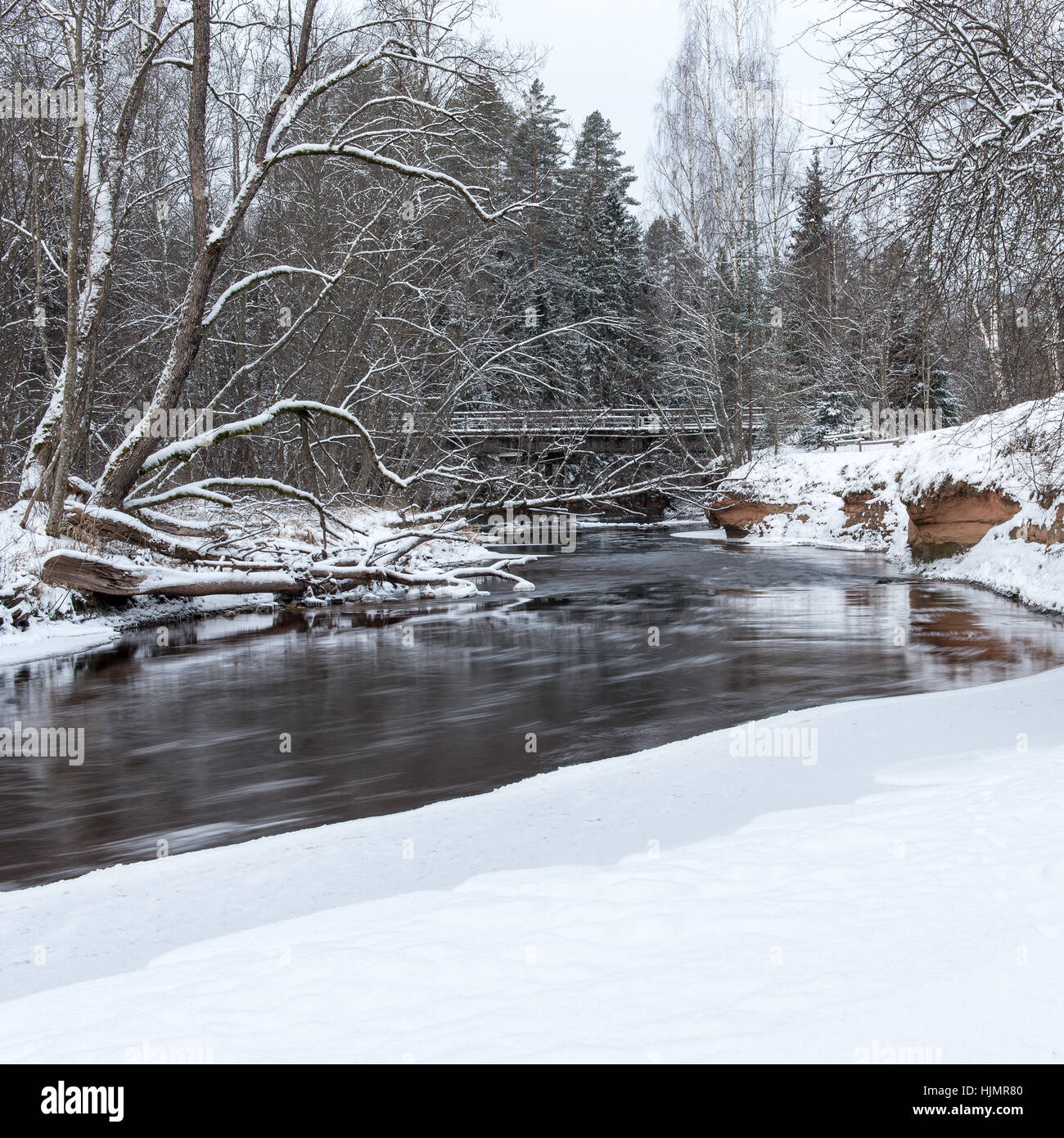 Frozen winter river landscape with ice and snow Stock Photo - Alamy