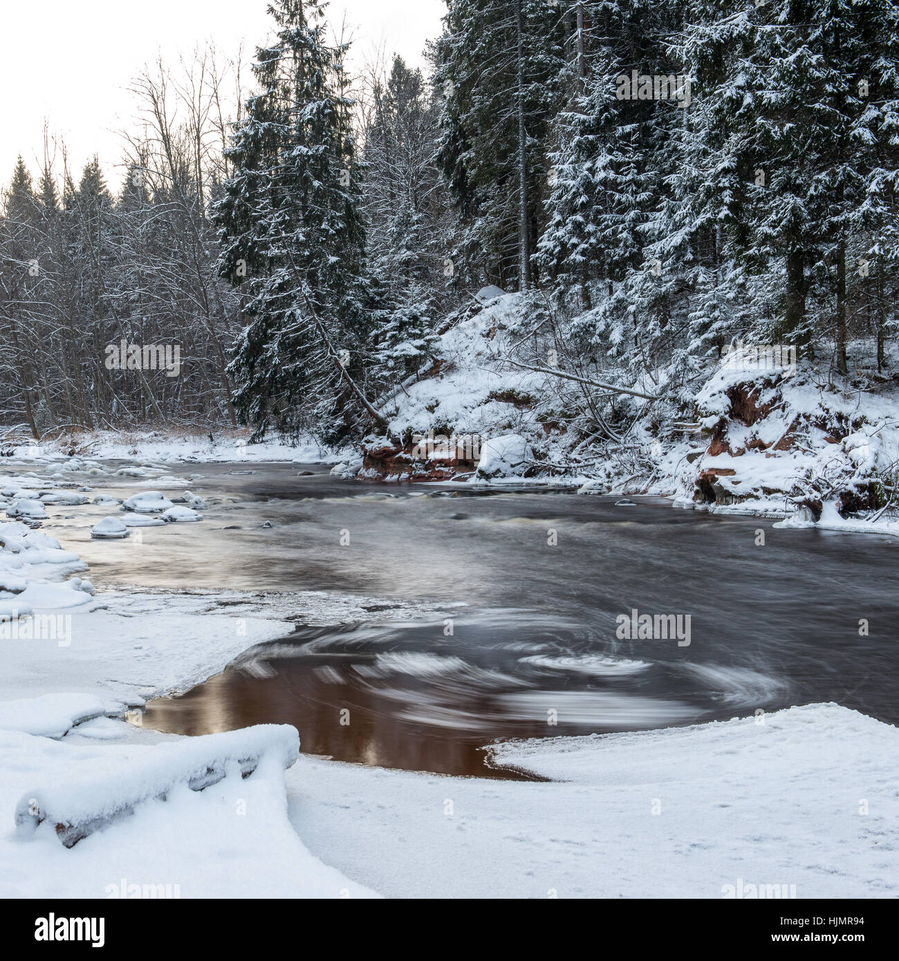 Frozen winter river landscape with ice and snow Stock Photo - Alamy