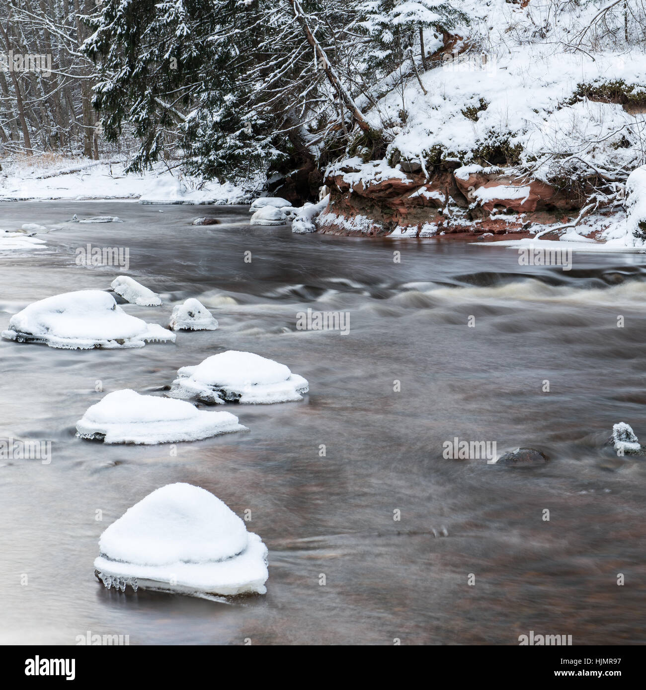 Frozen winter river landscape with ice and snow Stock Photo - Alamy