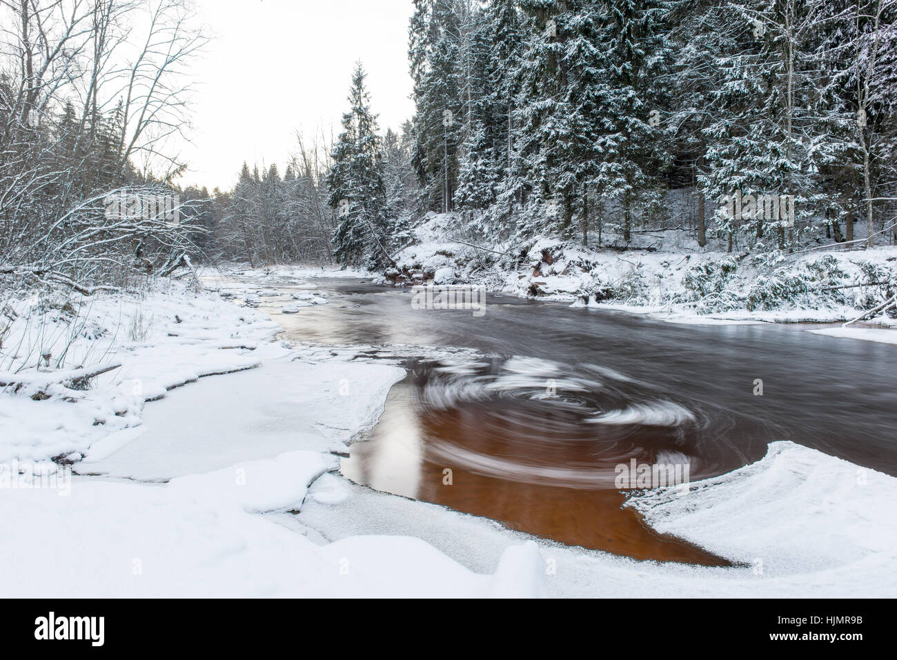 Frozen winter river landscape with ice and snow Stock Photo - Alamy