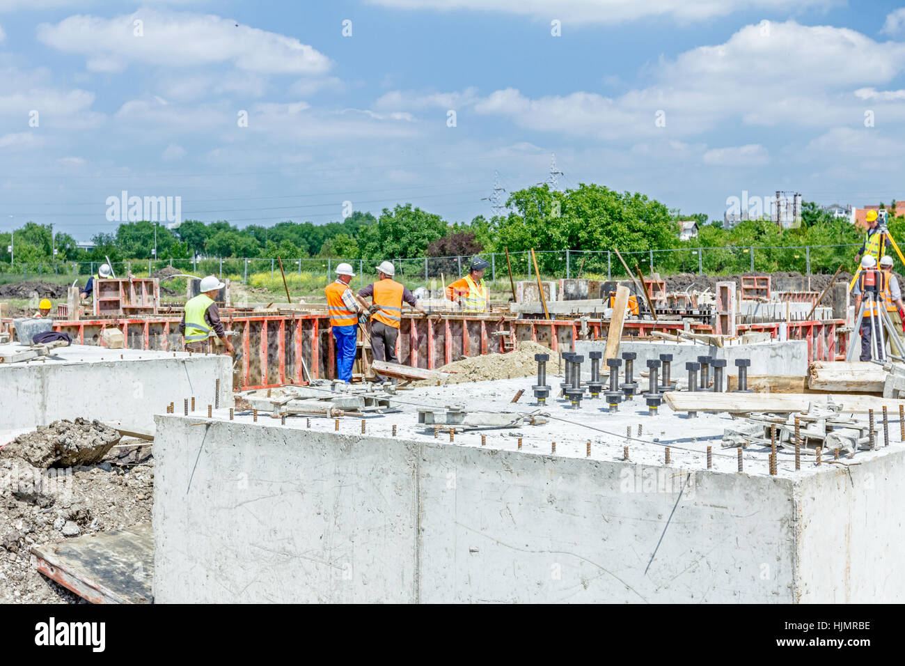 Concrete base of new edifice with reinforcement at building site is ...